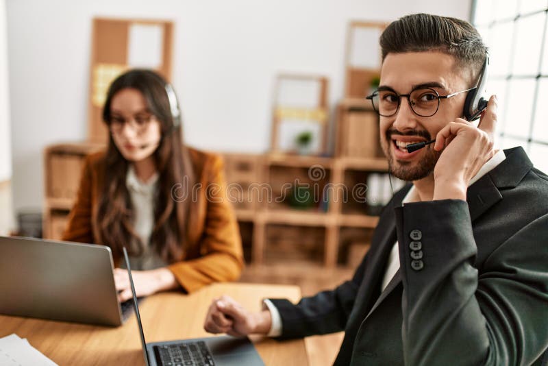 Two Hispanic Call Center Agents Working at the Office Stock Image ...