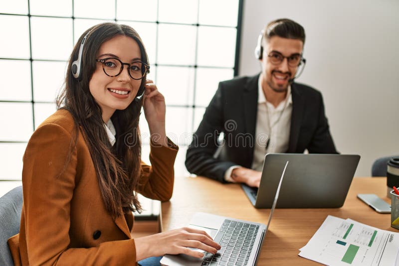 Two Hispanic Call Center Agents Working at the Office Stock Image ...