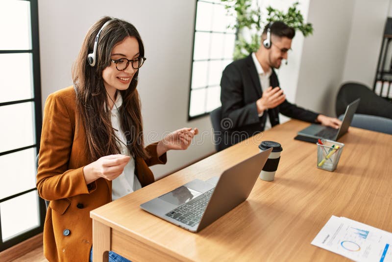Two Hispanic Call Center Agents Working at the Office Stock Image ...