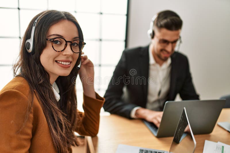 Two Hispanic Call Center Agents Working at the Office Stock Photo ...