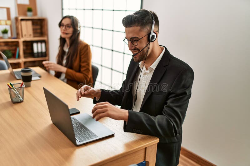 Two Hispanic Call Center Agents Working at the Office Stock Photo ...