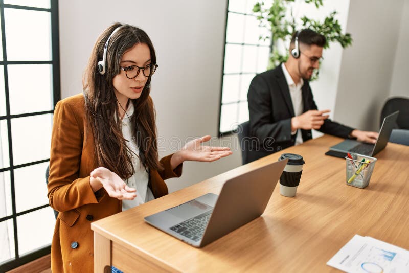 Two Hispanic Call Center Agents Working at the Office Stock Photo ...