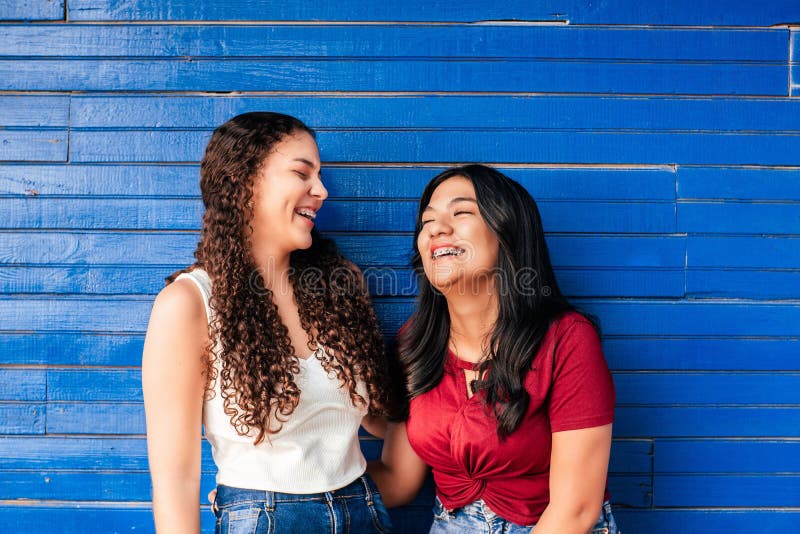 Two Hispanic Friends with Brackets Laughing Together Stock Image ...