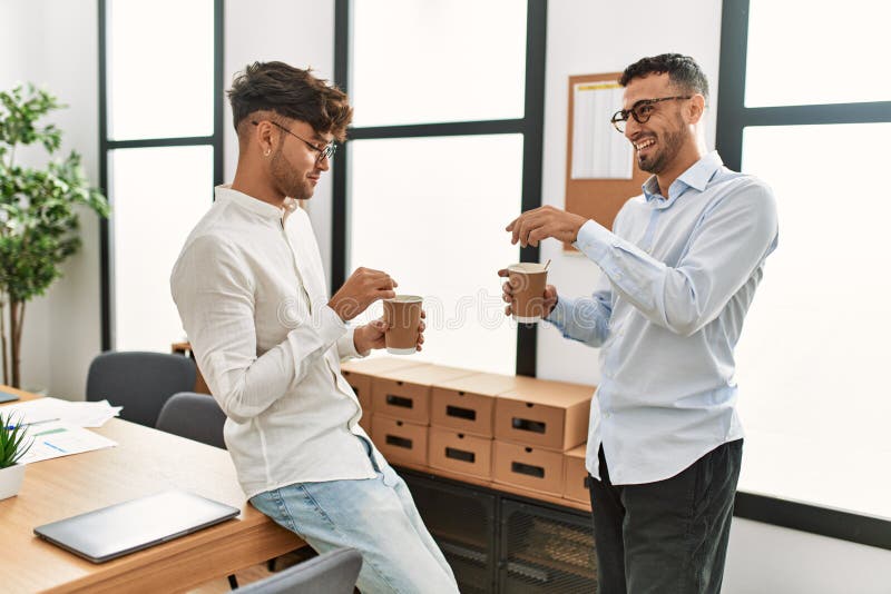 Two Hispanic Men Business Workers Drinking Coffee Working at Office ...