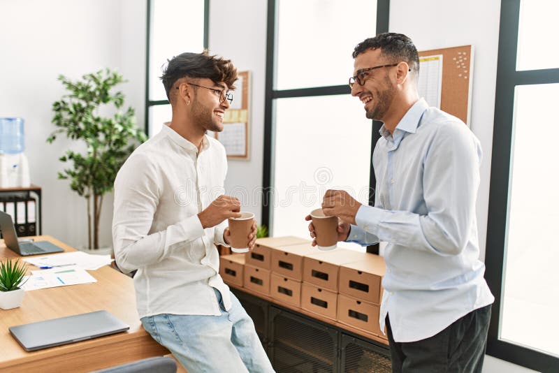 Two Hispanic Men Business Workers Drinking Coffee Working at Office ...