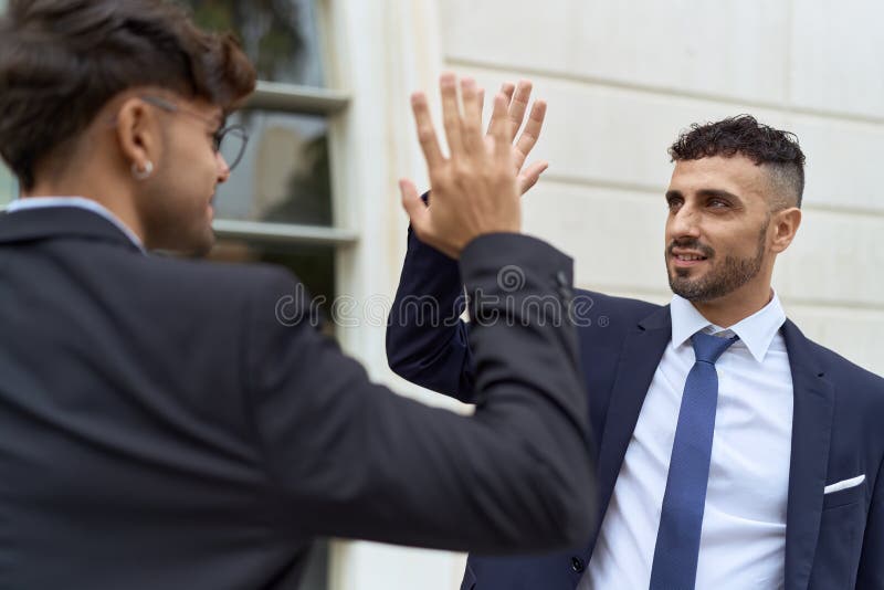 Two Hispanic Men Business Workers High Five with Hands Raised Up at ...