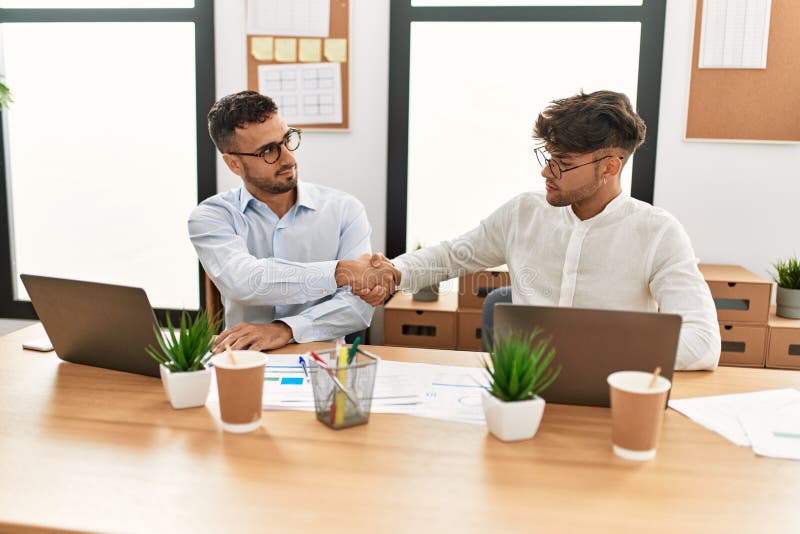 Two Hispanic Men Business Workers Shake Hands Working at Office Stock ...