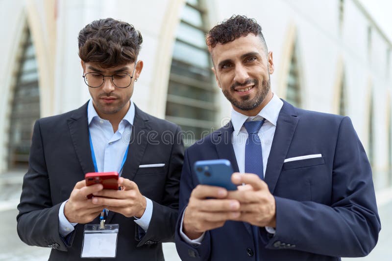 Two Hispanic Men Business Workers Smiling Confident Using Smartphones ...