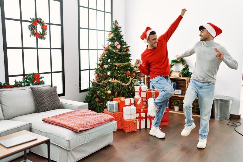 Two Hispanic Men Couple Dancing and Standing by Christmas Tree at Home ...