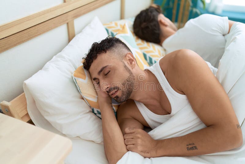 Two Hispanic Men Couple Lying on Bed Sleeping at Bedroom Stock Photo - Image of wake, tired ...