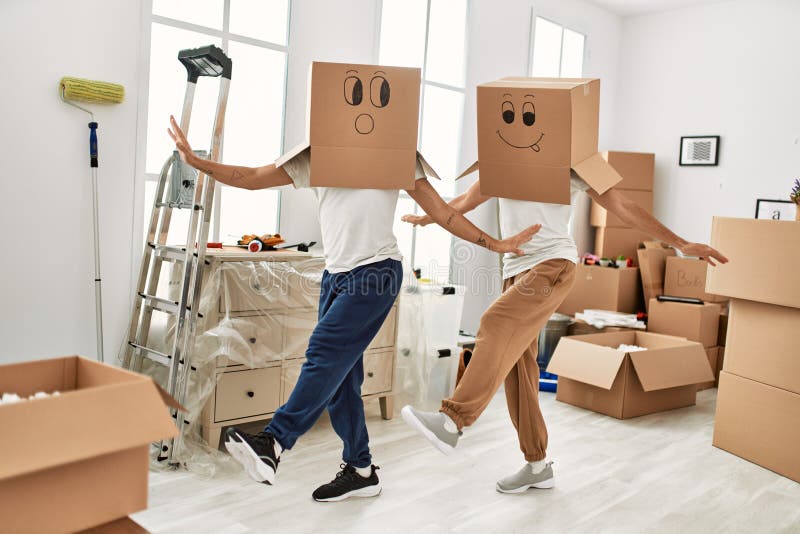 Two Hispanic Men Couple Playing with Funny Cardboard Boxes on Head at ...