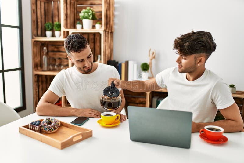 Two Hispanic Men Couple Pouring Coffee Having Breakfast at Home Stock ...