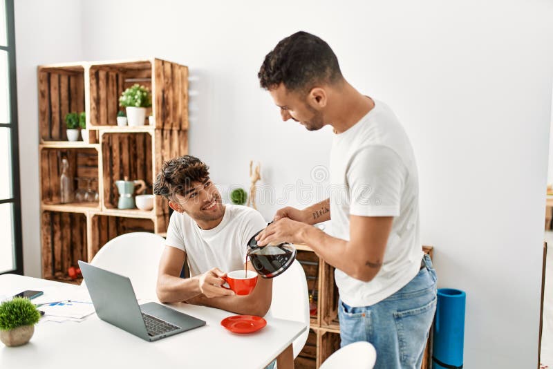 Two Hispanic Men Couple Pouring Coffee Having Breakfast at Home Stock ...