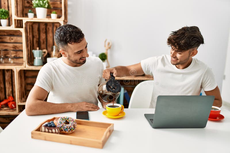 Two Hispanic Men Couple Pouring Coffee Having Breakfast at Home Stock ...