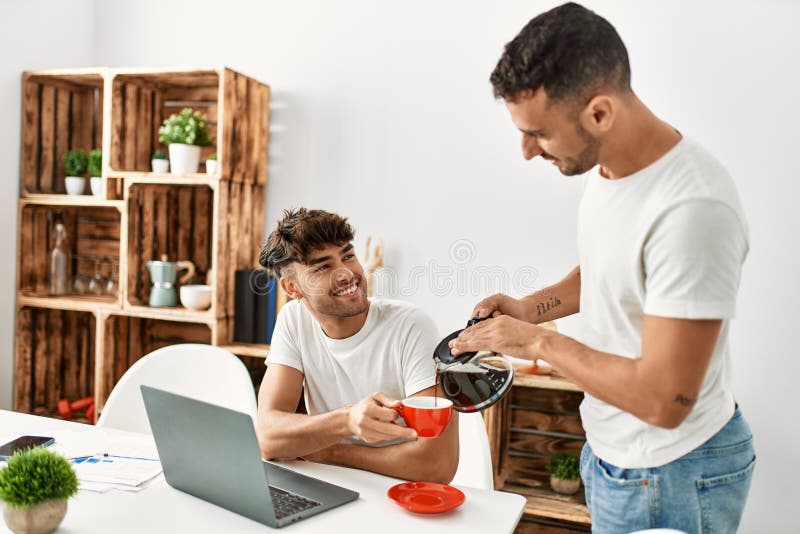 Two Hispanic Men Couple Pouring Coffee Having Breakfast at Home Stock ...