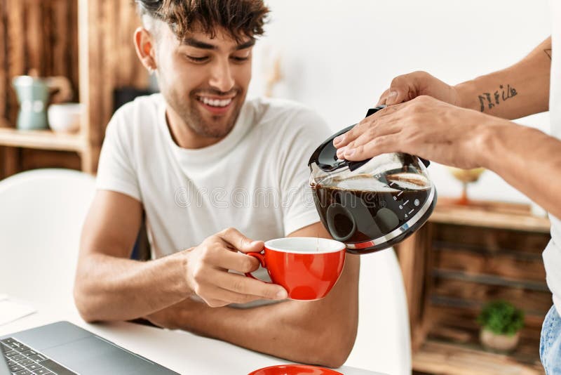Two Hispanic Men Couple Pouring Coffee Having Breakfast at Home Stock ...