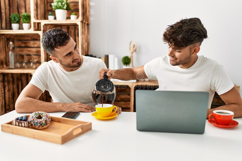 Two Hispanic Men Couple Pouring Coffee Having Breakfast at Home Stock ...