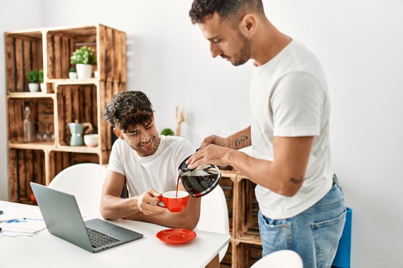 Two Hispanic Men Couple Pouring Coffee Having Breakfast at Home Stock ...