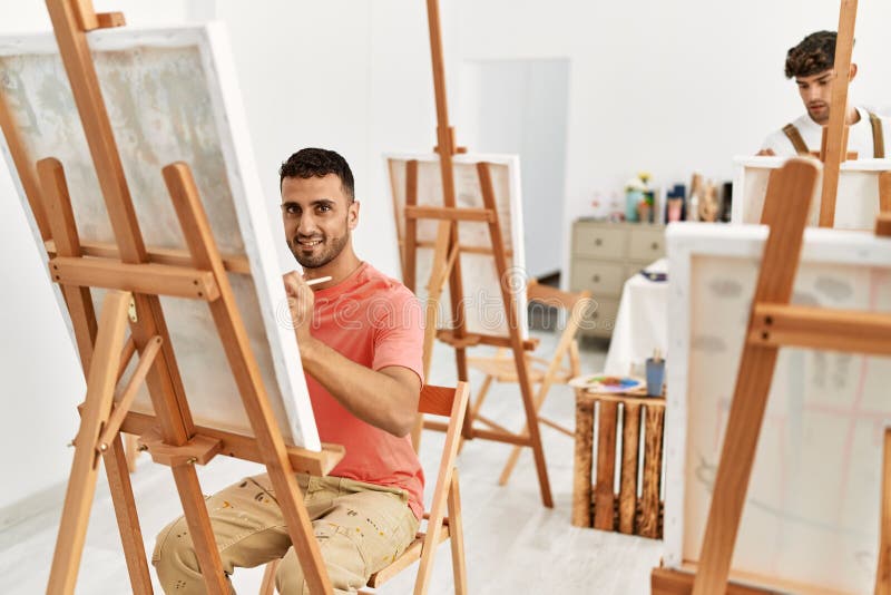 Two Hispanic Men Couple Smiling Confident Drawing at Art Studio Stock ...