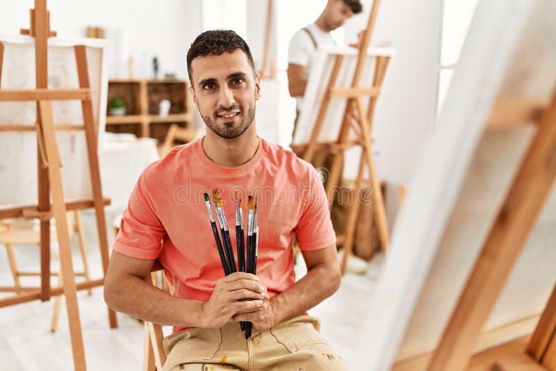 Two Hispanic Men Couple Smiling Confident Drawing at Art Studio Stock ...