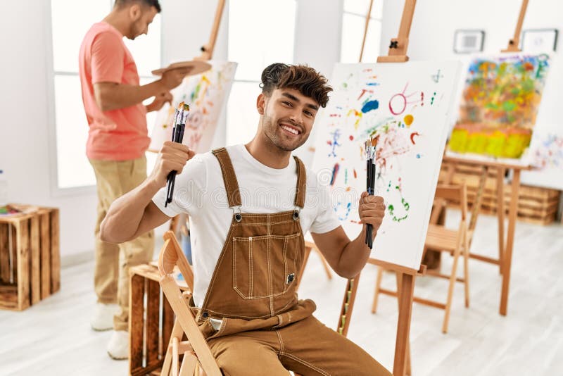 Two Hispanic Men Couple Smiling Confident Drawing at Art Studio Stock ...