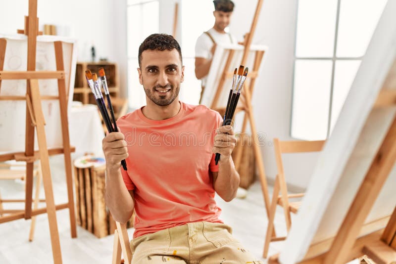 Two Hispanic Men Couple Smiling Confident Drawing at Art Studio Stock ...