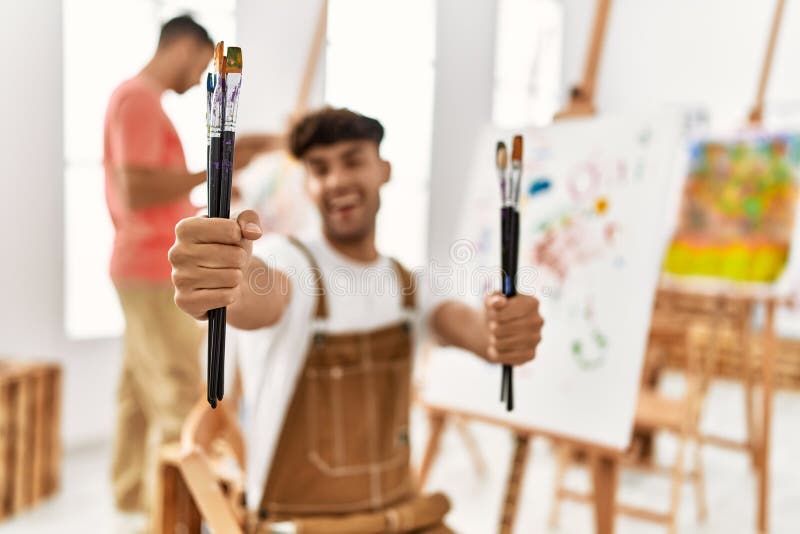 Two Hispanic Men Couple Smiling Confident Drawing at Art Studio Stock ...