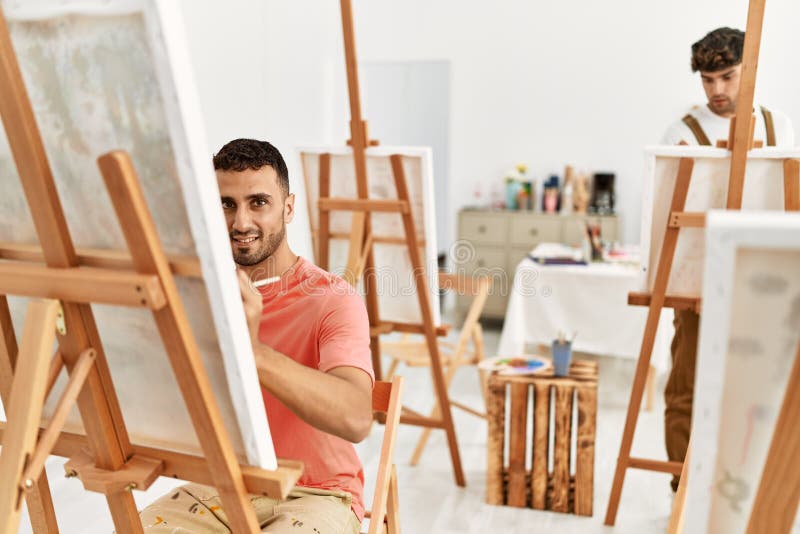 Two Hispanic Men Couple Smiling Confident Drawing at Art Studio Stock ...