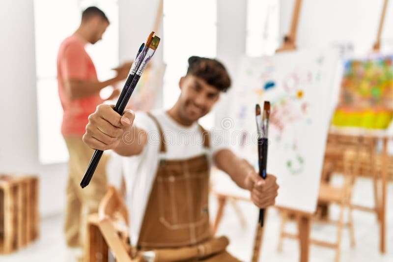 Two Hispanic Men Couple Smiling Confident Drawing at Art Studio Stock ...