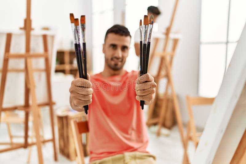 Two Hispanic Men Couple Smiling Confident Drawing at Art Studio Stock ...