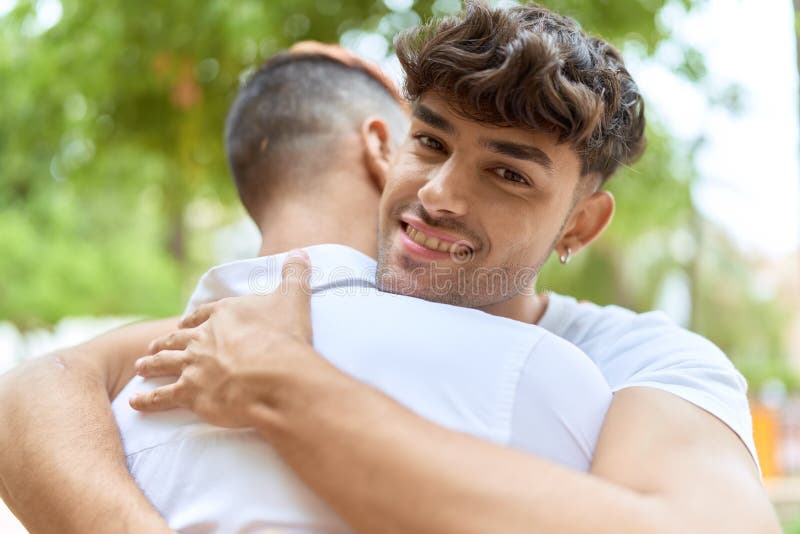 Two Hispanic Men Couple Smiling Confident Hugging Each Other at Park ...