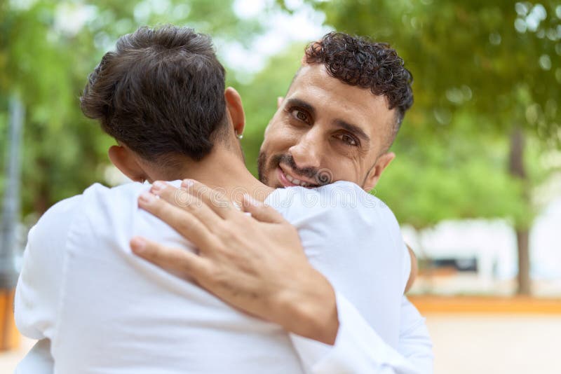 Two Hispanic Men Couple Smiling Confident Hugging Each Other at Park ...