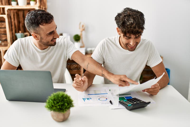 Two Hispanic Men Couple Smiling Confident Using Laptop Working at Home ...