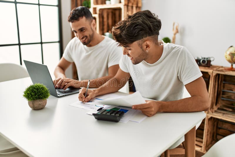 Two Hispanic Men Couple Smiling Confident Using Laptop Working at Home ...