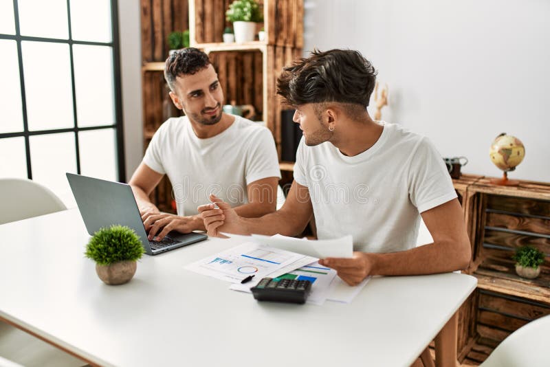 Two Hispanic Men Couple Smiling Confident Using Laptop Working at Home ...