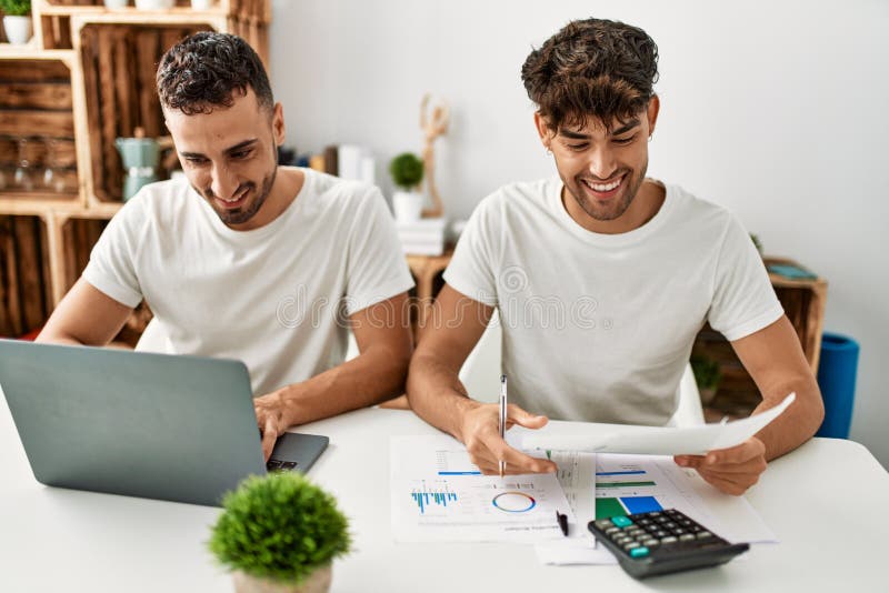 Two Hispanic Men Couple Smiling Confident Using Laptop Working at Home ...