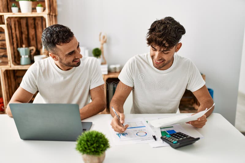 Two Hispanic Men Couple Smiling Confident Using Laptop Working at Home ...