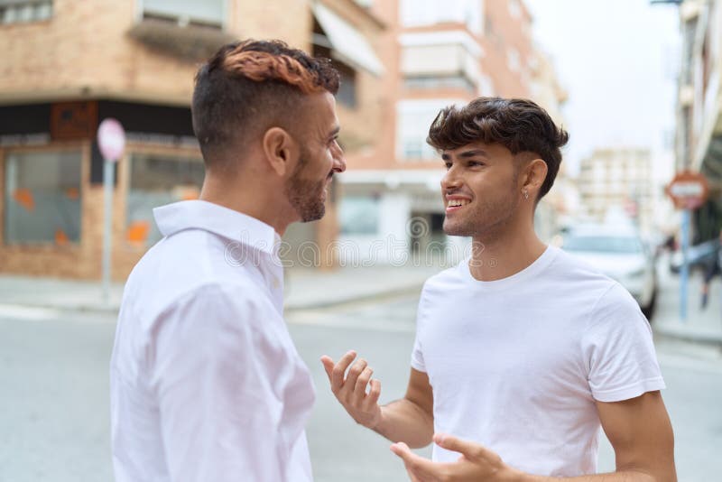 Two Hispanic Men Couple Standing Together Speaking at Street Stock ...