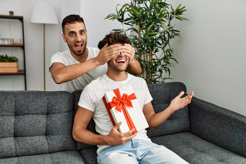 Two Hispanic Men Couple Surprise with Gift and Hands on Eyes at Home ...