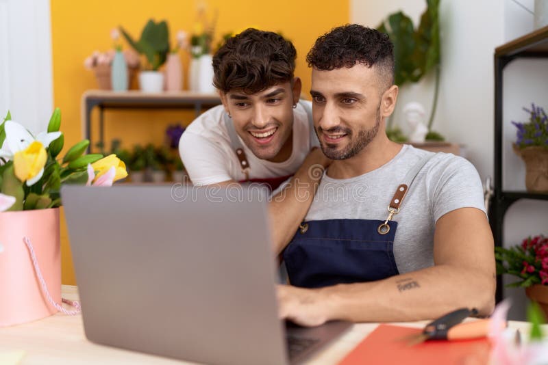 Two Hispanic Men Florists Smiling Confident Using Laptop Working at ...