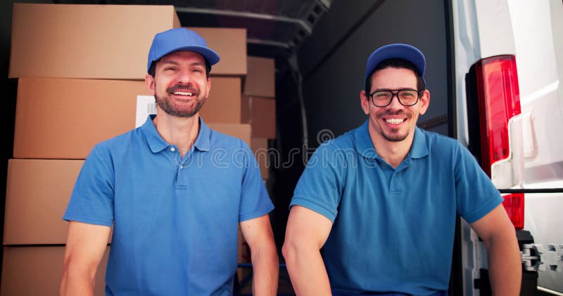 Two Hispanic Movers Unloading Boxes after Successful Moving Day Stock ...
