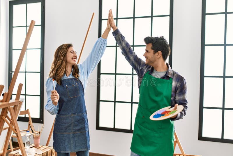 Two Hispanic Students Smiling Happy High Five at Art School Stock Image ...