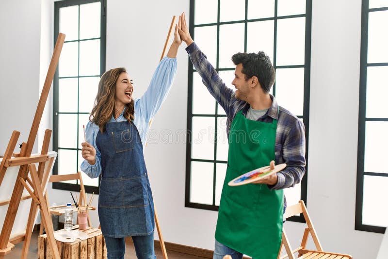 Two Hispanic Students Smiling Happy High Five at Art School Stock Image ...