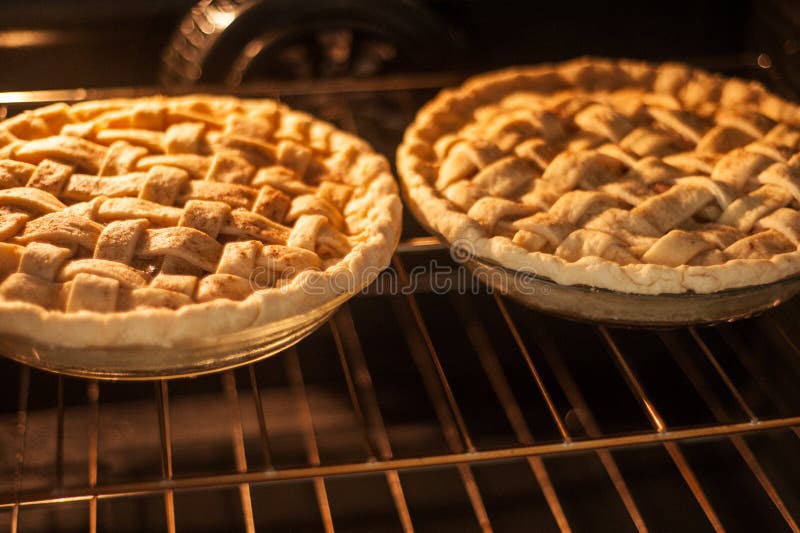 Two pies in an oven stock photo. Image of fruit, thanksgiving - 121289504