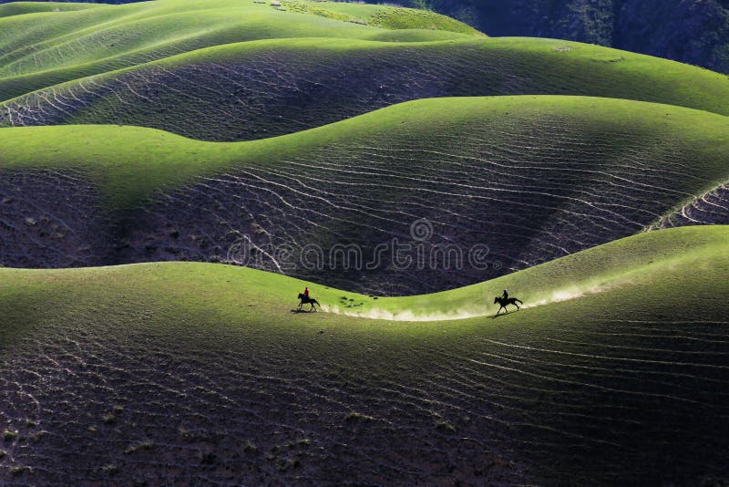 Two Horsemen in the Farmland Rolling Hill with Dramatic Sunset Light ...