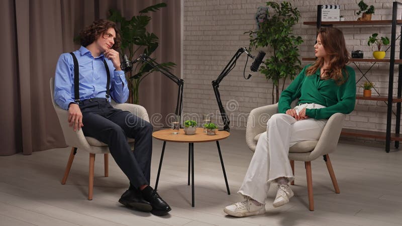 Engaging Podcast Interview in a Modern Studio Setting with Two Dynamic ...