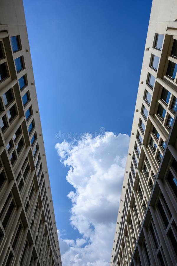 Two House Fronts Facing Each Other with Blue Sky and Clouds Stock Photo ...