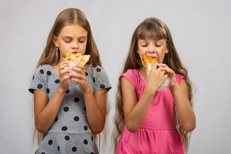 Two hungry girls eat bread stock image. Image of hair - 152806703