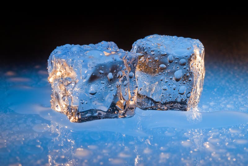 Two ice cubes on blue stock photo. Image of freezer, transparent - 9334574