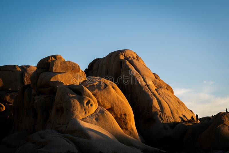 Two Large Rock Formations Next To Each Other with Sky in Background ...